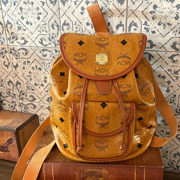 MCM | Bags | Mcm Vintage Tan Mini Backpack With Logo Pattern Leather ...